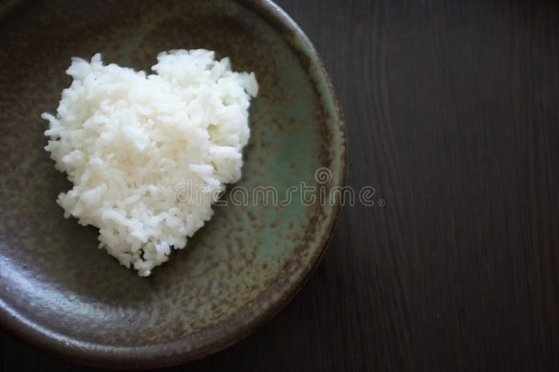 Top View Heart Shape of Cooked Rice in a Dish . Copy Space for Text ...
