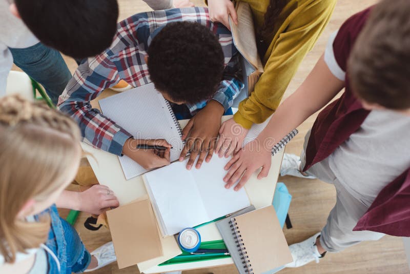 Top View of High School Students Helping Their Classmate Stock Photo ...