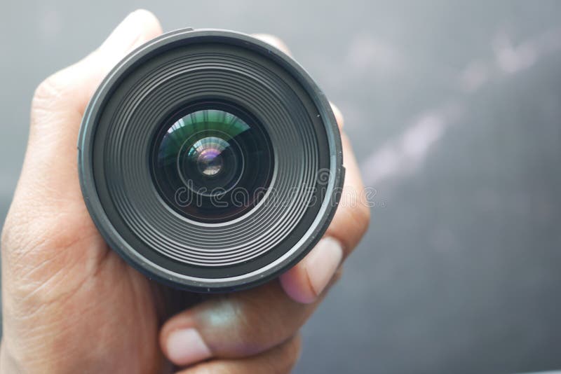 Top View of Holding a Camera Lenses Stock Photo - Image of glass ...