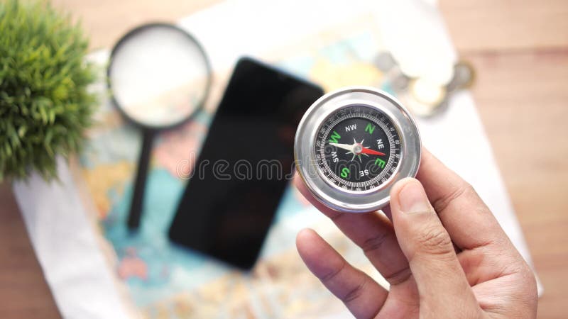 Top View of Holding a Compus with Travel Map on Table, Stock Video ...