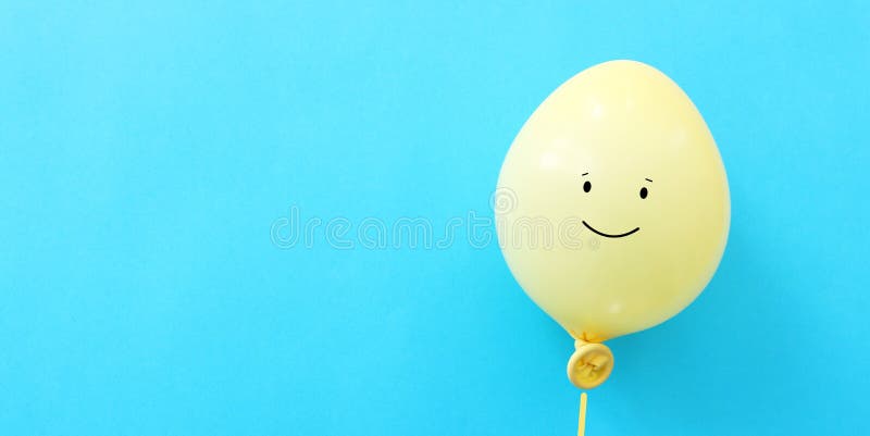 Top View Image of Balloon with Happy Face Over Blue Background Stock ...