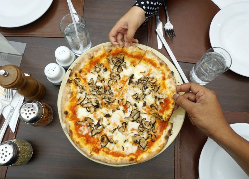 Human Hand Picking Pepperoni Pizza Stock Photos - Free & Royalty-Free ...