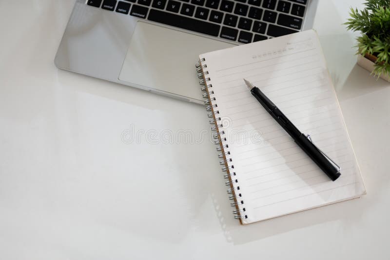 Top View Image of a Modern Office Desk with a Laptop Computer, a Pen ...