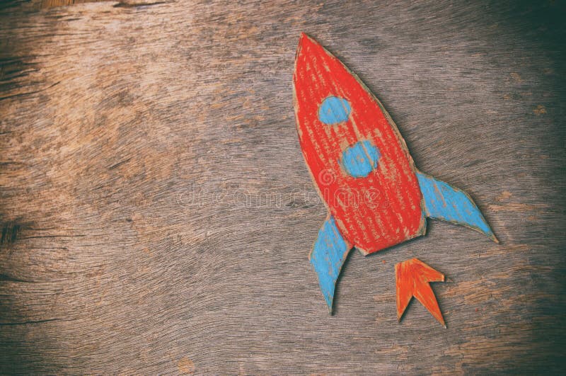 Top View Image of Rocket Cut from Paper and Painted Over Wooden Grunge ...