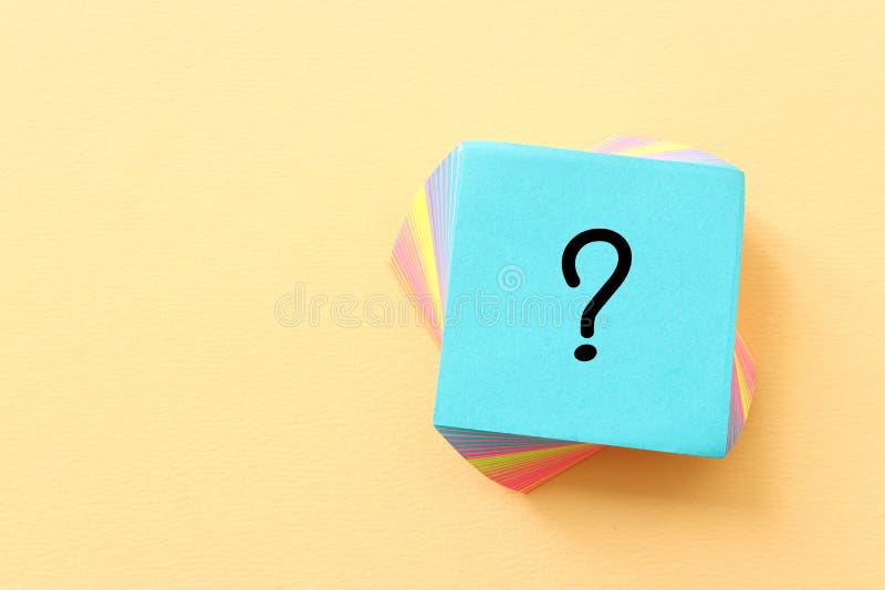 Sticky Note and Question Mark Over Textured Paper Stock Photo - Image ...