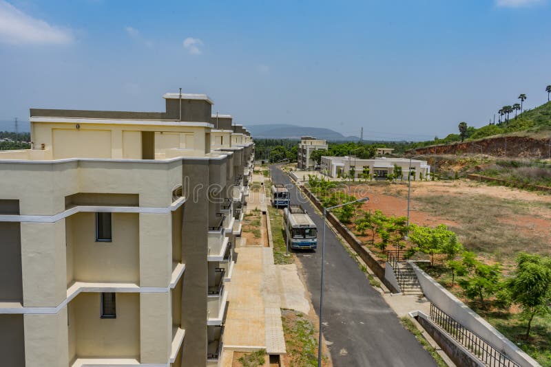 Top View of an Indian Colony with Bitumen Road Inside Parking a Bus ...