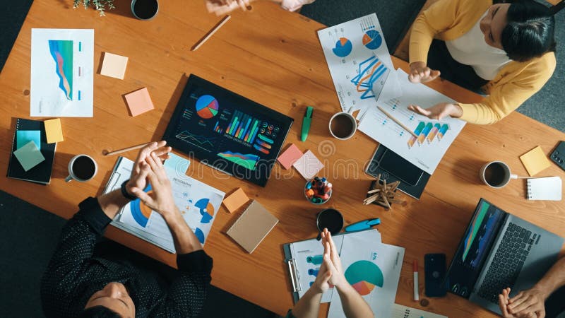 Top View of Investor Brainstorm while Look at Financial Statistic ...