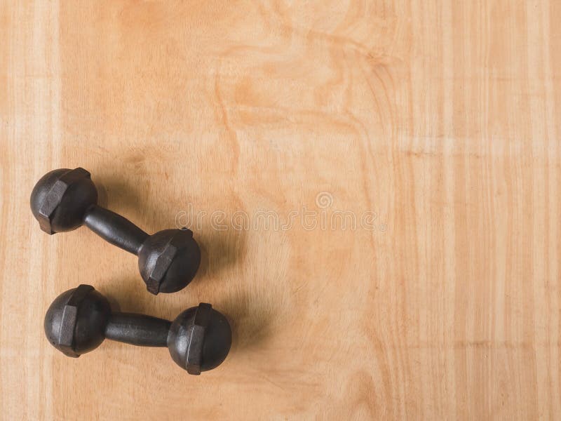 Top View of Iron Dumbbells or Exercise Weights on Wooden Table Stock ...