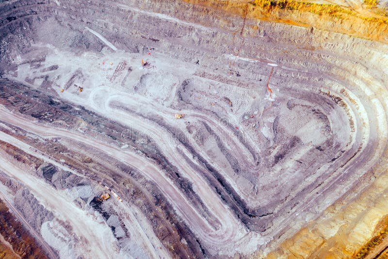 Top View of an Iron Ore Quarry. Excavator Loading Ore into Train Cars ...