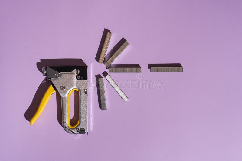 Top View of Yellow Mechanical Construction Stapler and Stapler Staples ...