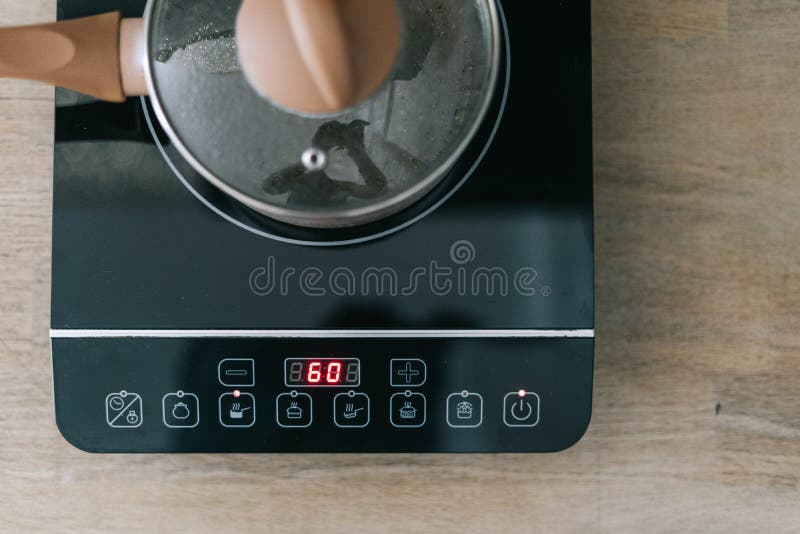 Pan at Small Electric Stove with Control Panel in Kitchen Stock Image ...