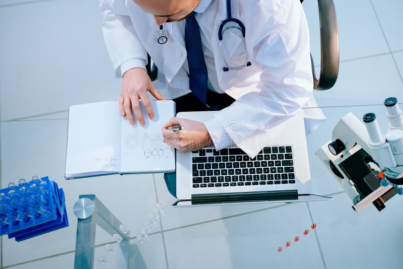 Top View. Lab Scientist Using a Laptop To Save Data Stock Image - Image ...