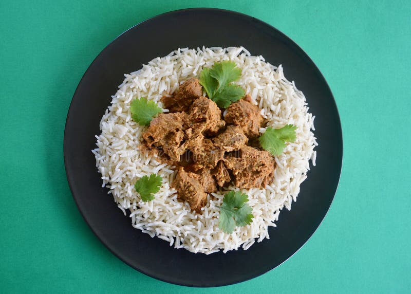 A Top View of Lamb Korma with Basmati Rice and Coriander Leaves Stock ...