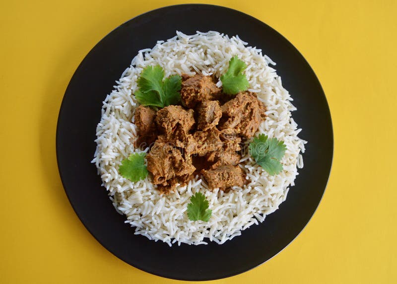 A Top View of Lamb Korma with Basmati Rice and Coriander Leaves Stock ...