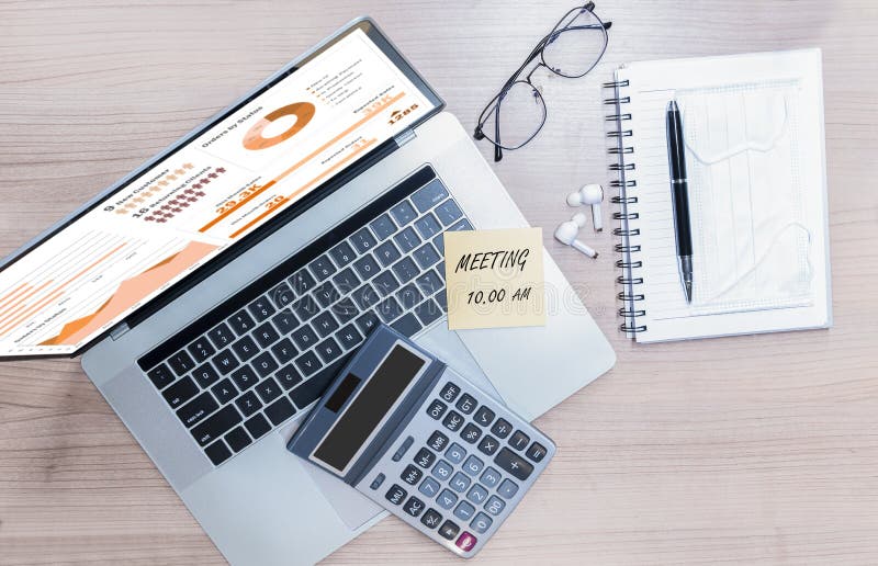 Top View Laptop ,calculator and Memo Paper with Message Meeting 10.00 ...