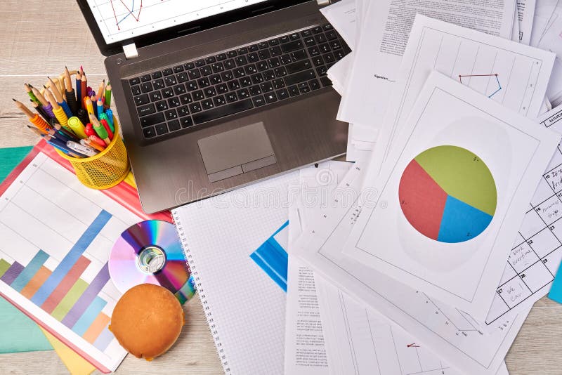 Top View Laptop and Many Work Papers with Statistic Diagrams. Stock ...