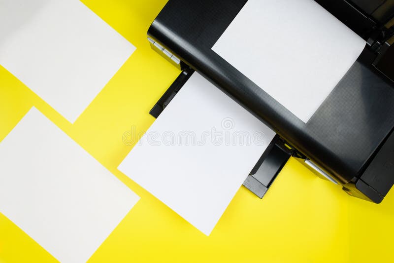 Top View of the Printer and Blank Sheets of Paper on a Yellow ...