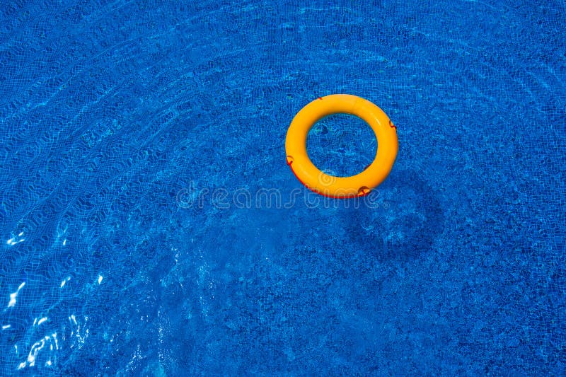 Top View of Lifebuoy Floating in Blue Swimming Pool, Soft Focus Stock ...