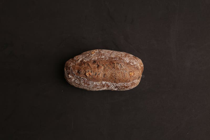 Top View of a Loaf of Dry Brown Bread on a Black Surface Stock Image ...