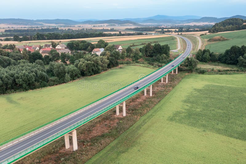 Top View of a Long Bridge Passing through Green Fields Stock Photo ...