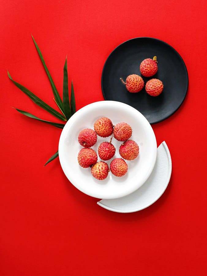 Top View of Lychee Tropical Fruit on a White Plate on a Red Surface ...