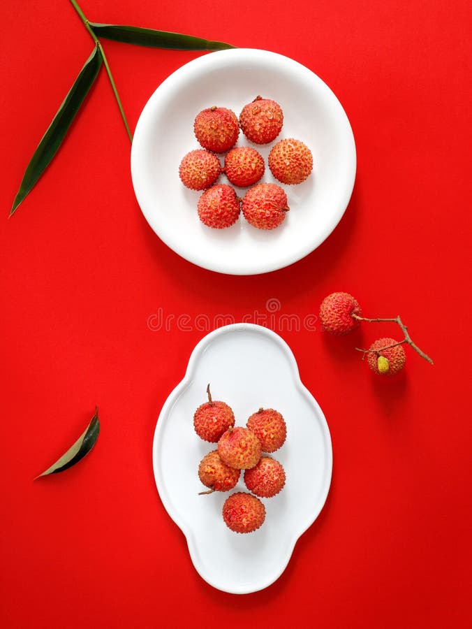 Top View of Lychee Tropical Fruit on a White Plate on a Red Surface ...
