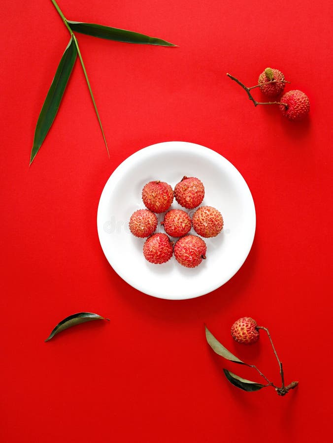 Top View of Lychee Tropical Fruit on a White Plate on a Red Surface ...
