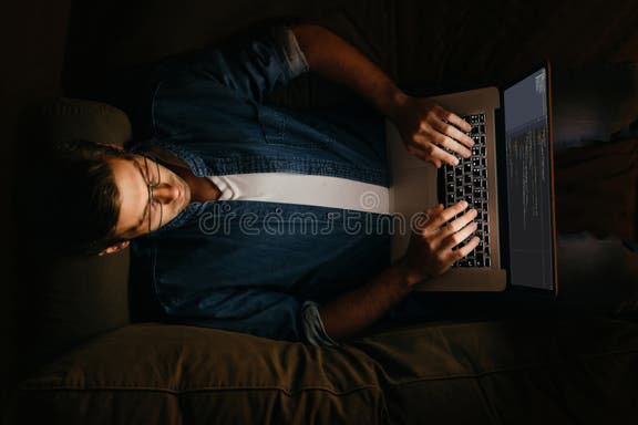 Programmer Laying on Sofa and Working at His Laptop Stock Image - Image of development ...