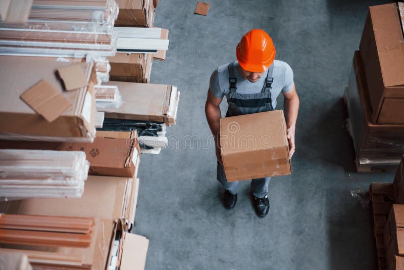 Top View of Male Worker in Warehouse with Box in Hands Stock Photo ...
