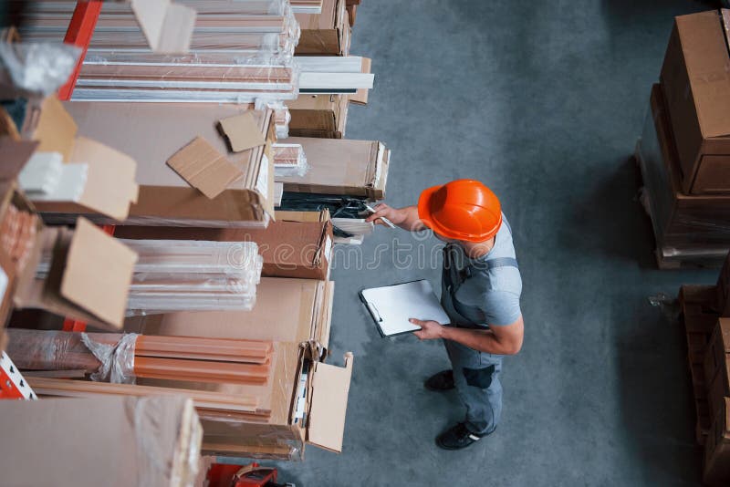 Top View of Male Worker in Warehouse with Notepad in Hands Stock Image ...