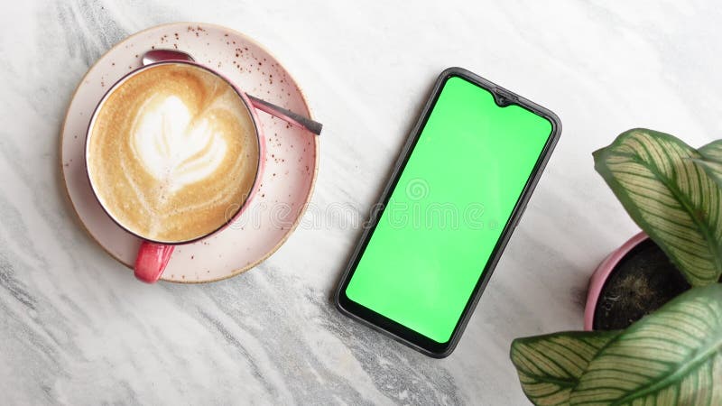 Top View of Man H Smart Phone with Green Screen Coffee on Table Stock ...