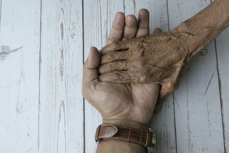 Top View of Man Hand Holding Senior Women Hand Stock Photo - Image of ...