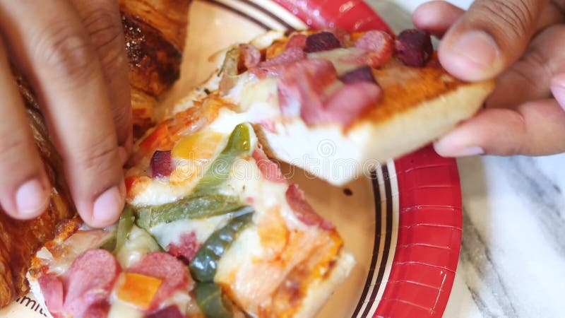 Top View of Man Hand Picking Slice of Pizza from a Plate Stock Footage ...