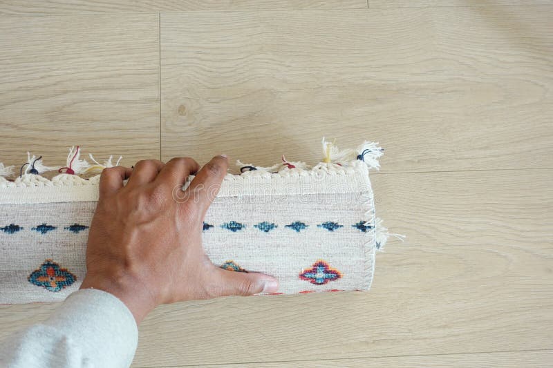 Top View of Man Hand Rolling Out New Rug. Stock Image - Image of human ...