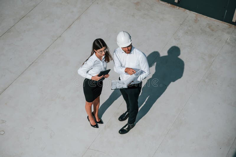 Top View. Man with Woman are Working on the Construction Project ...