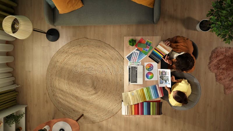 Top View of a Man and a Woman Working from Home. Young Designers are ...