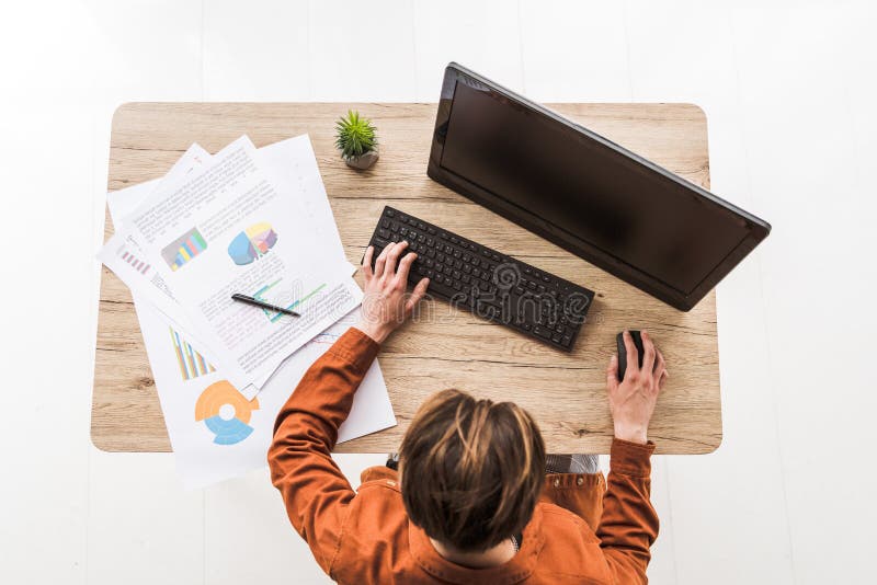 Top View of Man Working on Computer at Table with Infographics Stock ...