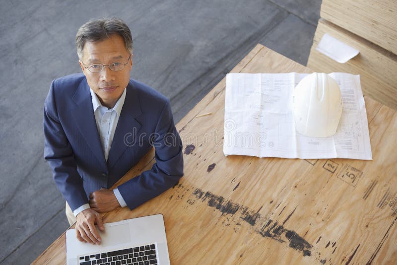 Top View of Manager Using Laptop on Plywood in Warehouse Stock Photo ...