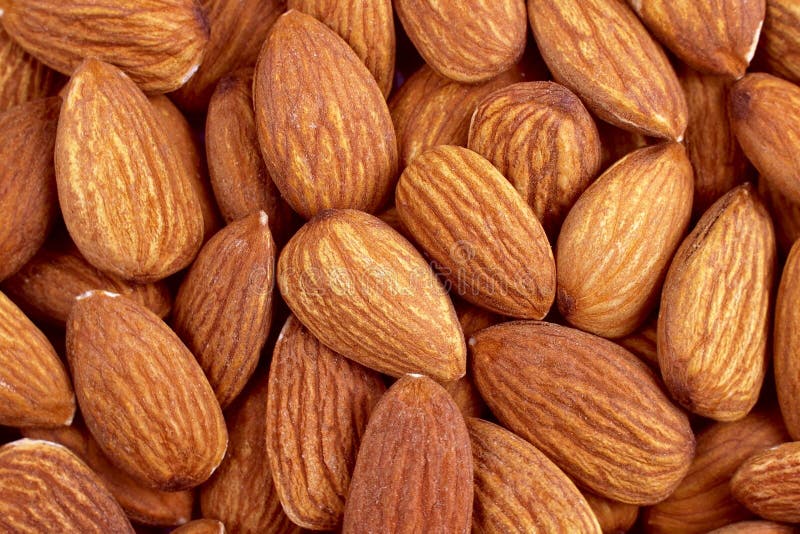 Top View of Many Brown Almond Nuts Texture Close Up. Stock Photo ...