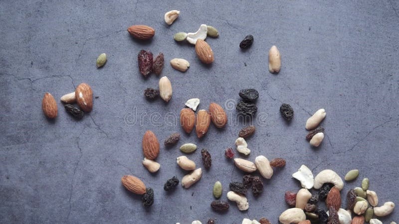 Top View of Many Mixed Nuts Falling on Black Background Stock Video ...