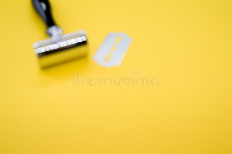 Top View of a Mechanical Razor and Blade Isolated on Yellow Background ...