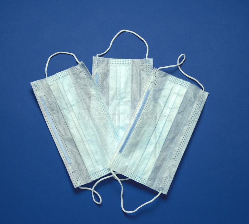 Medical Facial Mask Layout on a Blue Background Stock Photo - Image of ...