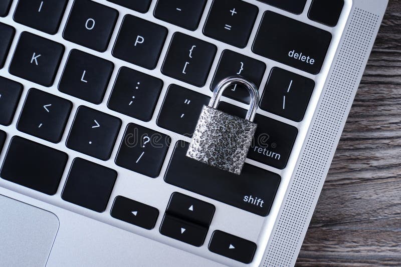 Top View of a Metal Padlock Lying on a Laptop Keyboard Stock Photo ...