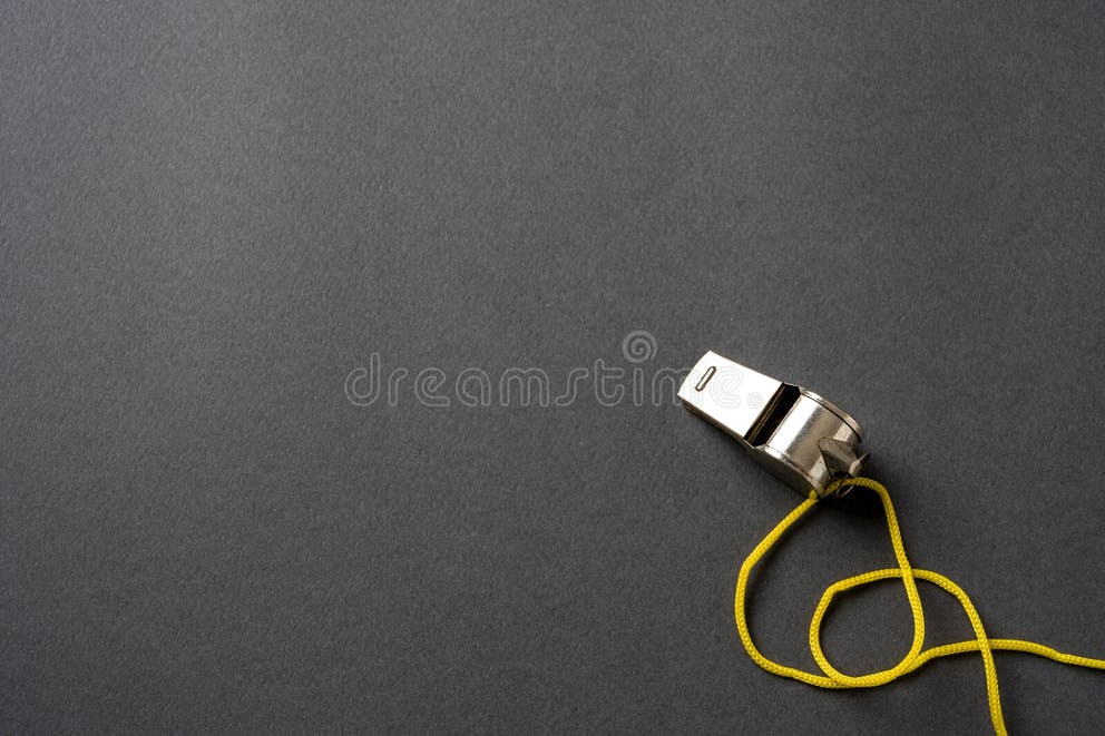 Top View of Metal Whistle with Yellow String on Dark Gray Background ...