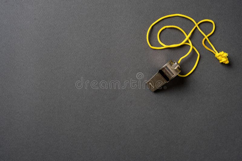 Top View of Metal Whistle with Yellow String on Dark Gray Background ...