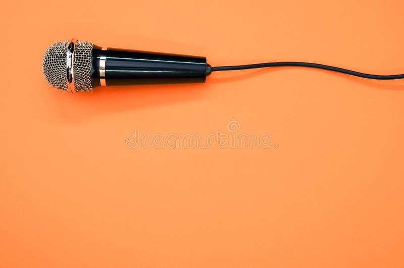 Top View of a Microphone on an Orange Surface Stock Image - Image of ...