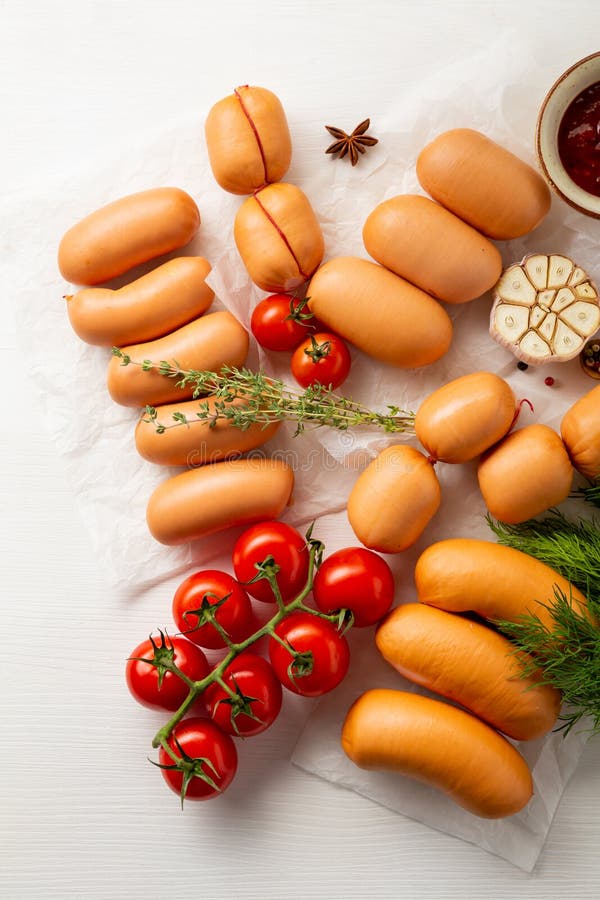 Top View Milk Sausages Assortment and Spices on Light Surface Stock ...