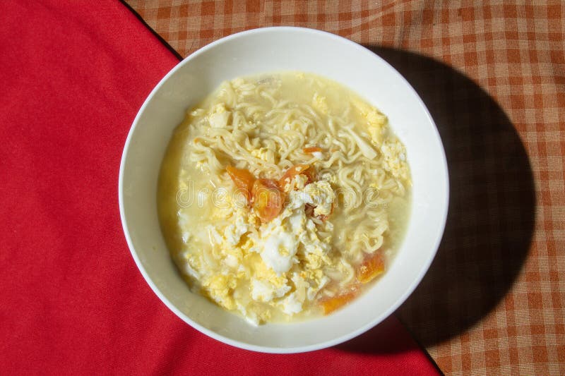 Top View of Mixed Yellow Noodle Soup with Egg and Tomato Stock Photo ...
