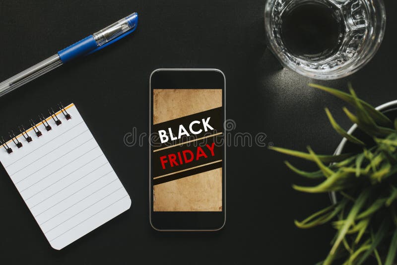Top View of Mobile Phone with Black Friday Label in the Screen, on a ...