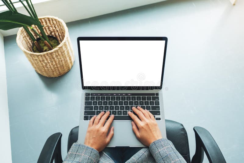A Woman Using and Typing on Laptop Computer with Blank White Desktop ...